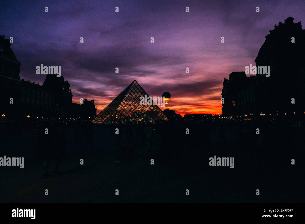 The cauldron, with the Olympic flame lit, lifts off while attached to a ...