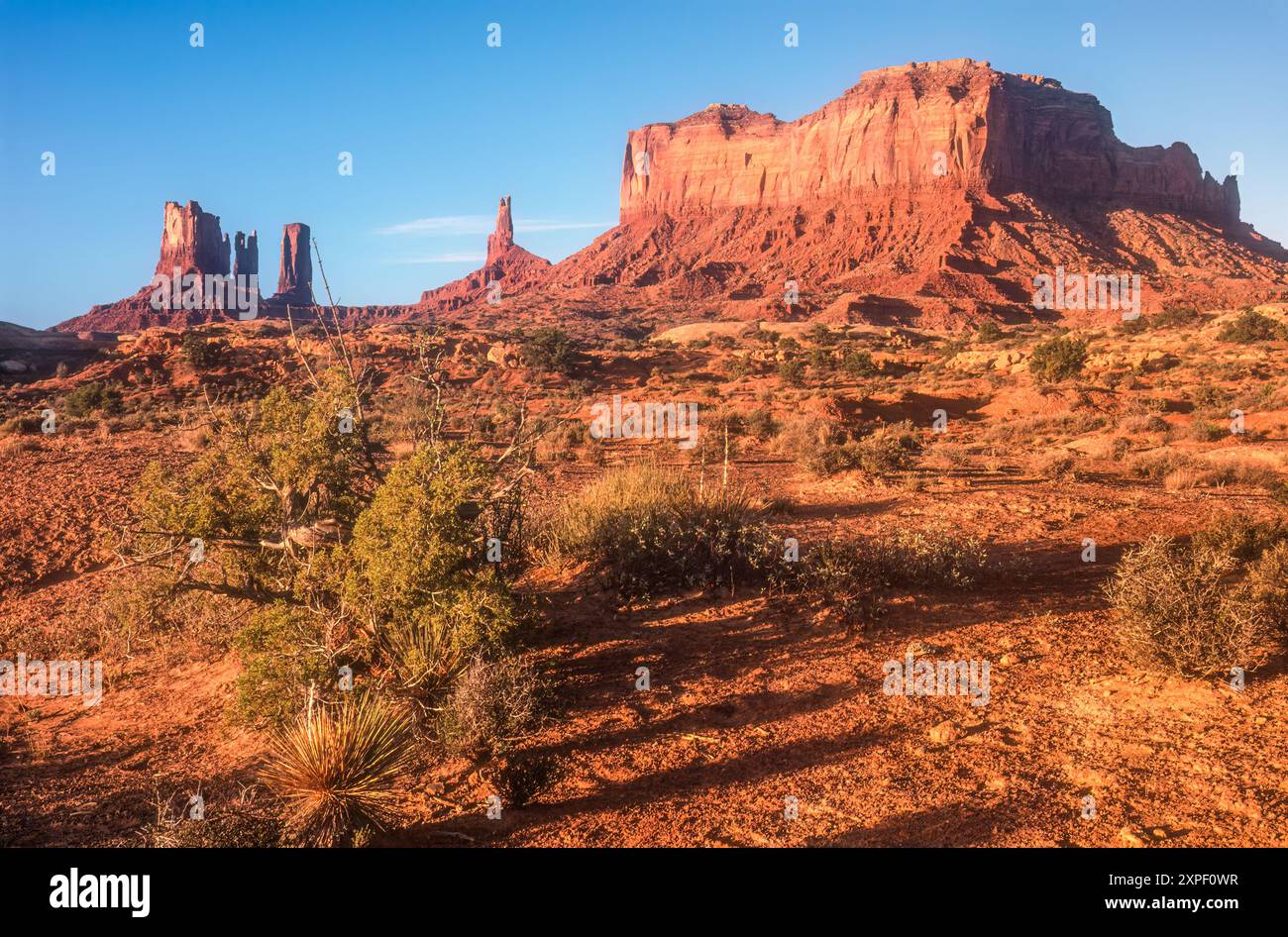 Monument Vally, Utah, sunrise view of (L to R) Stagecoach, Bear and ...