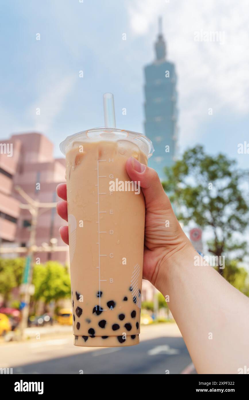 View of female hand holding Taiwanese bubble milk tea, Taipei Stock ...