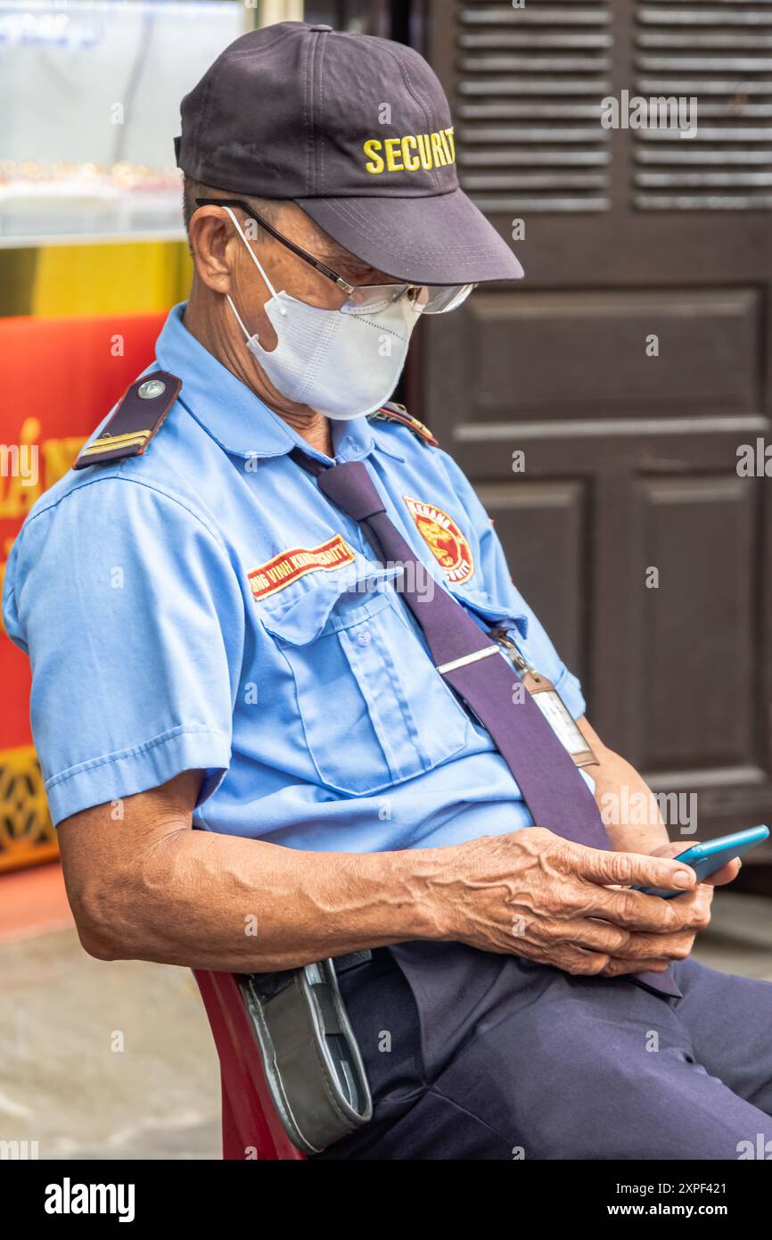 Security guard sitting on chair hi-res stock photography and images - Alamy