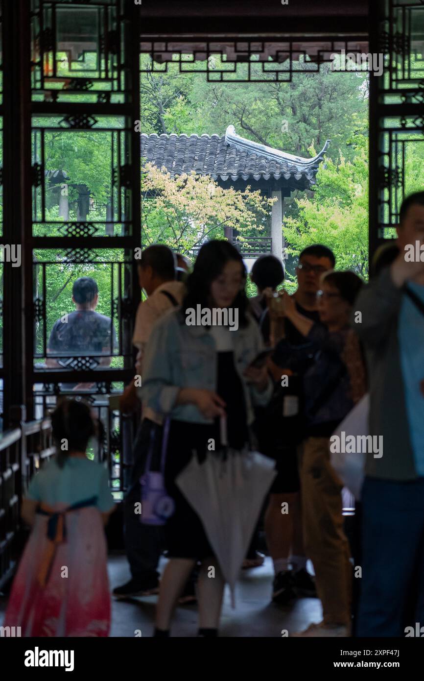 Suzhou, China - June 11, 2024 : A glimpse through a traditional Chinese ...
