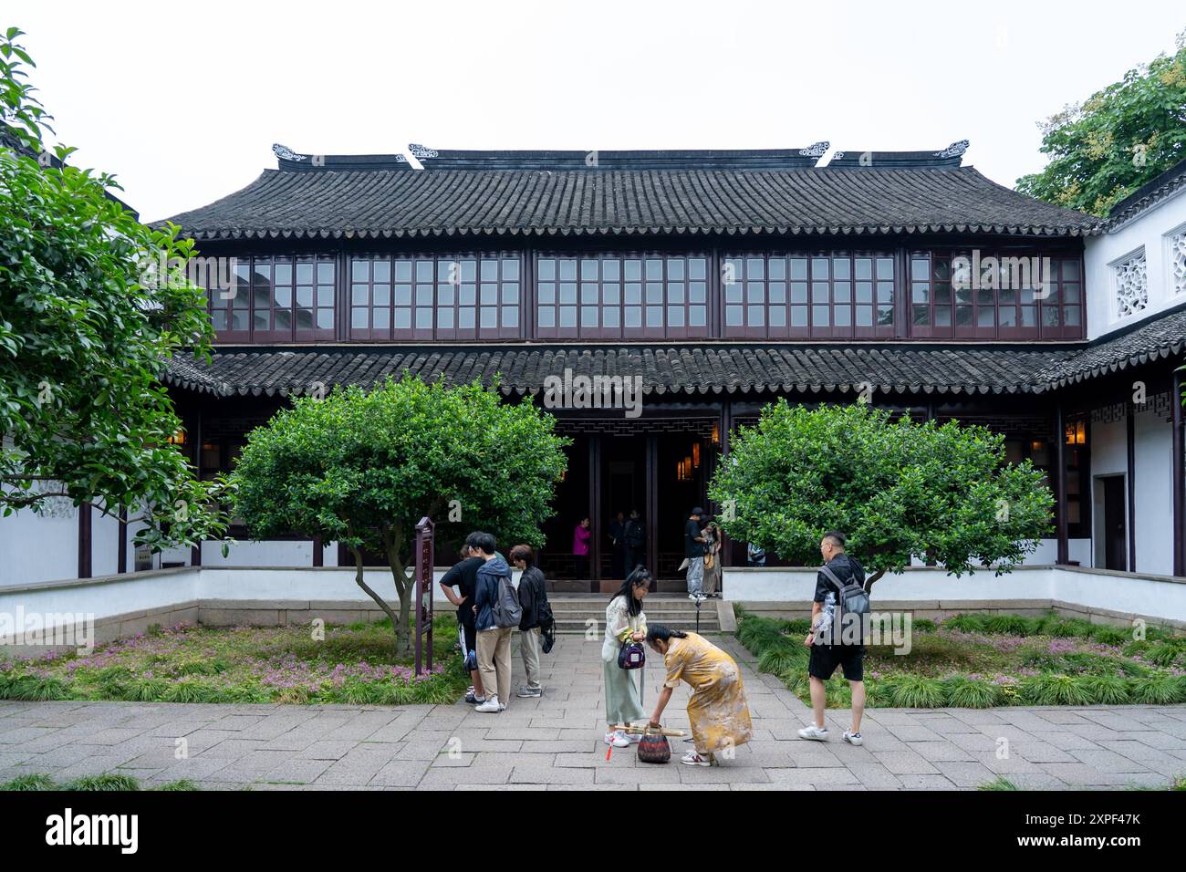 Suzhou, China - June 11, 2024 : A courtyard with a traditional Chinese ...