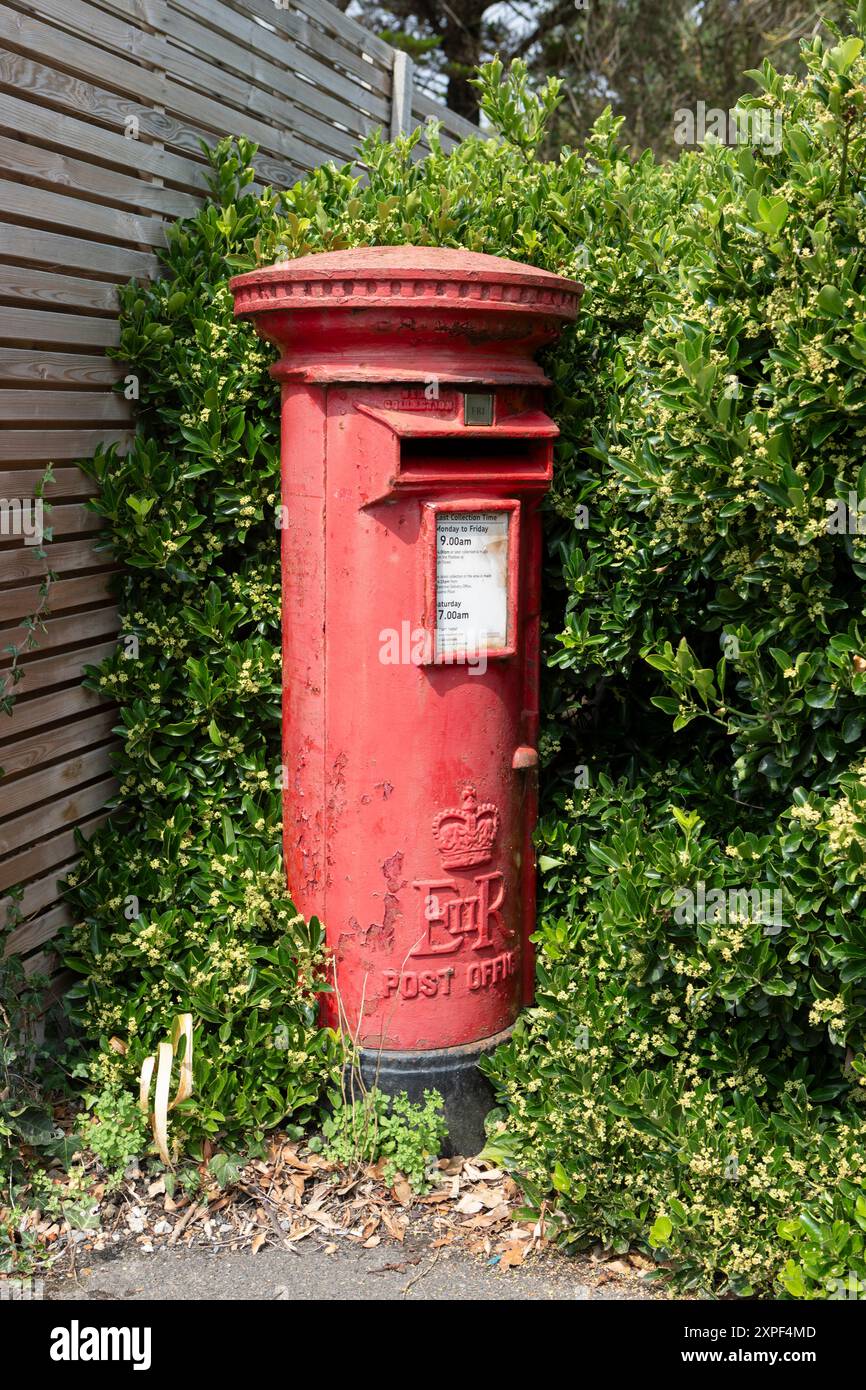 An old, worn Queen Elizabeth the second red letter box Stock Photo - Alamy