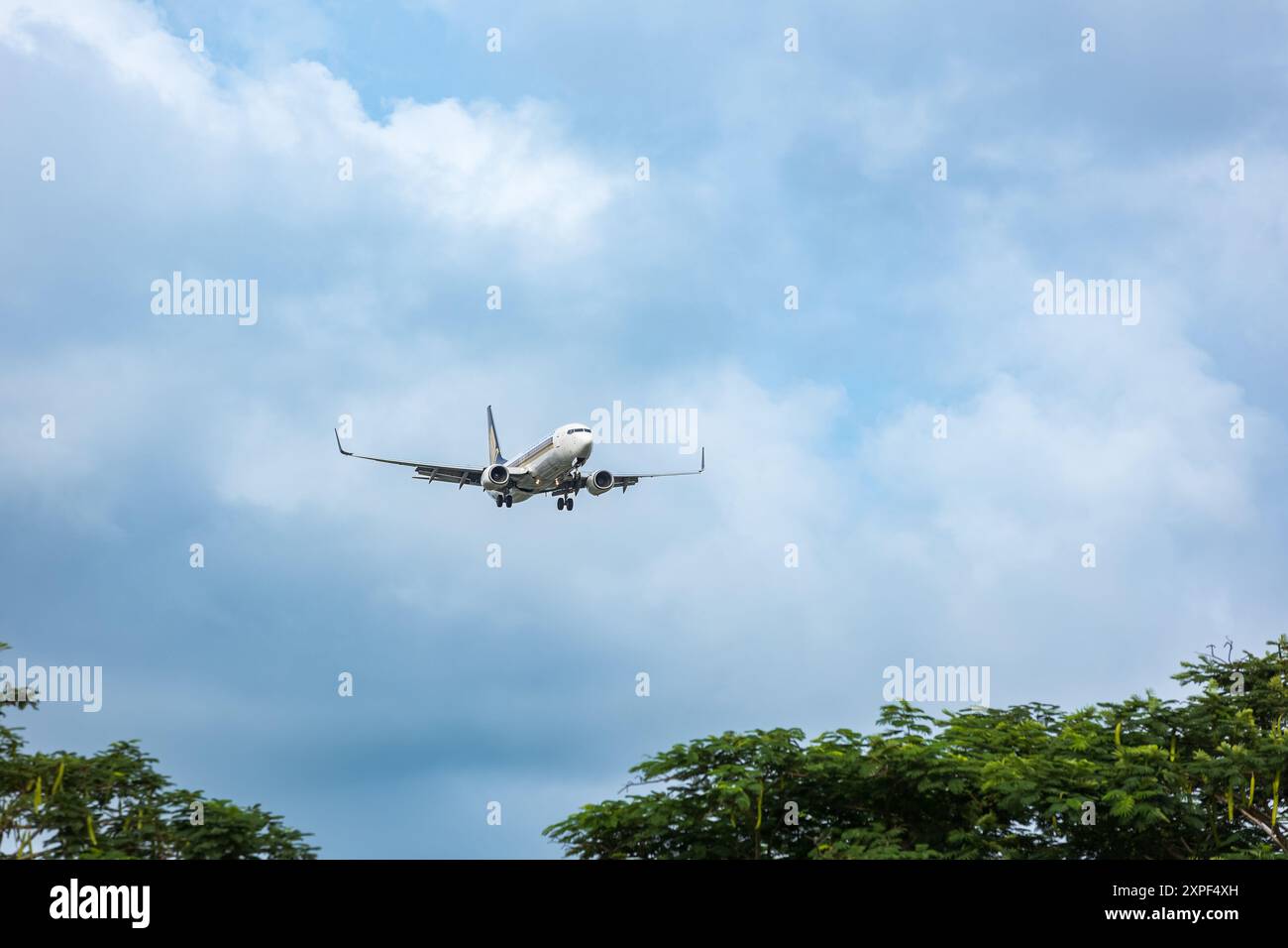 Singapore Airlines. Boeing flying in the air with clouds in the ...