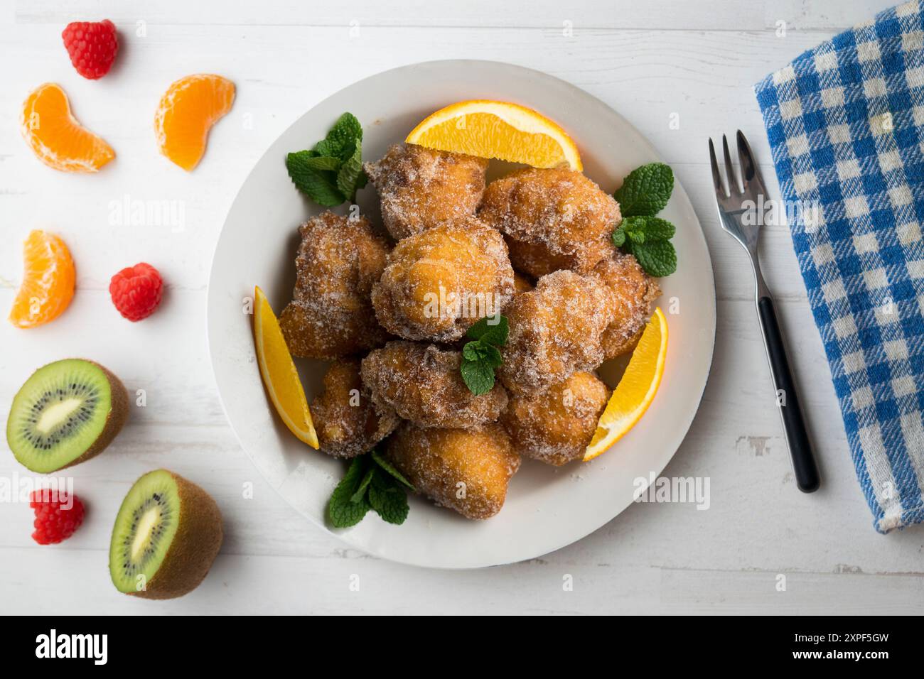 Delicious traditional Spanish fritters. Table decorated with Christmas ...