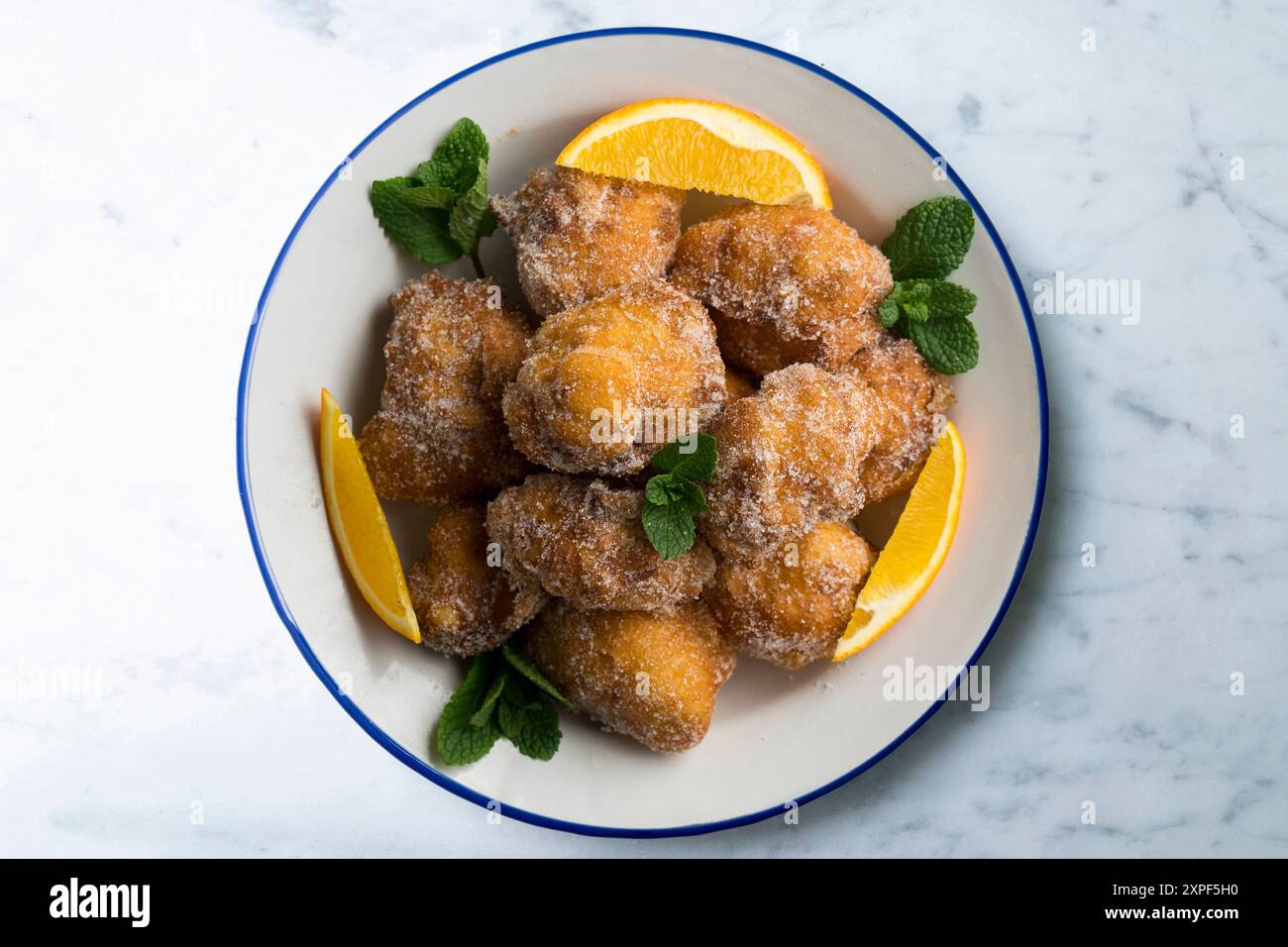 Delicious traditional Spanish fritters. Table decorated with Christmas ...