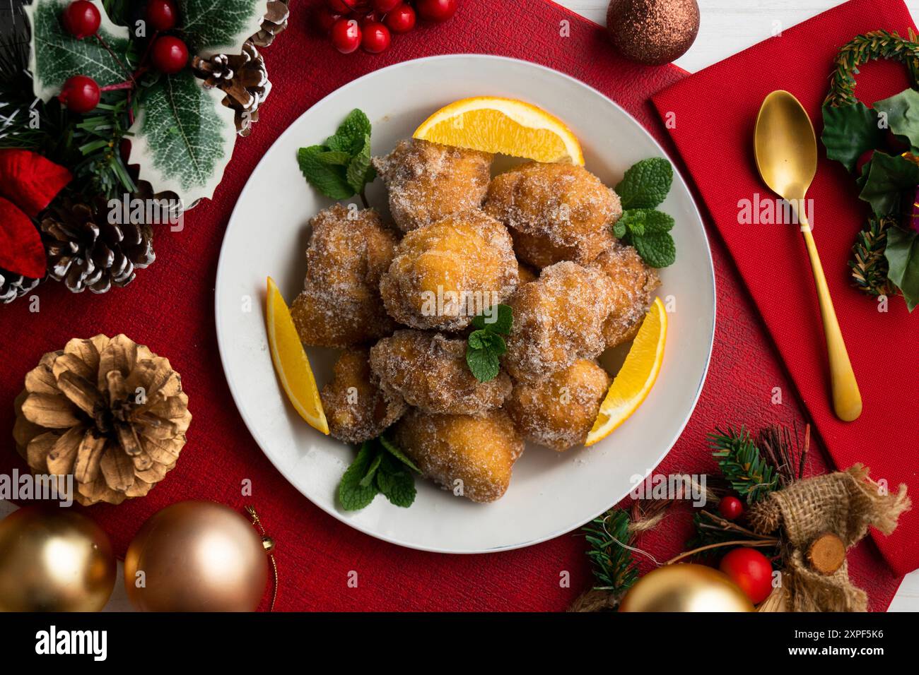 Delicious traditional Spanish fritters. Table decorated with Christmas ...