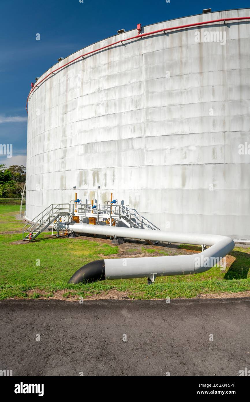 Oil refinery tanks storage in a grassy field - stock photo Stock Photo ...