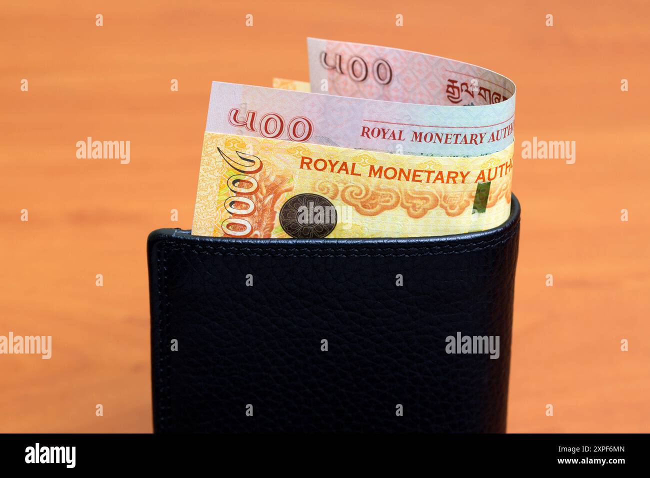 Bhutanese money - ngultrum in the black wallet Stock Photo - Alamy
