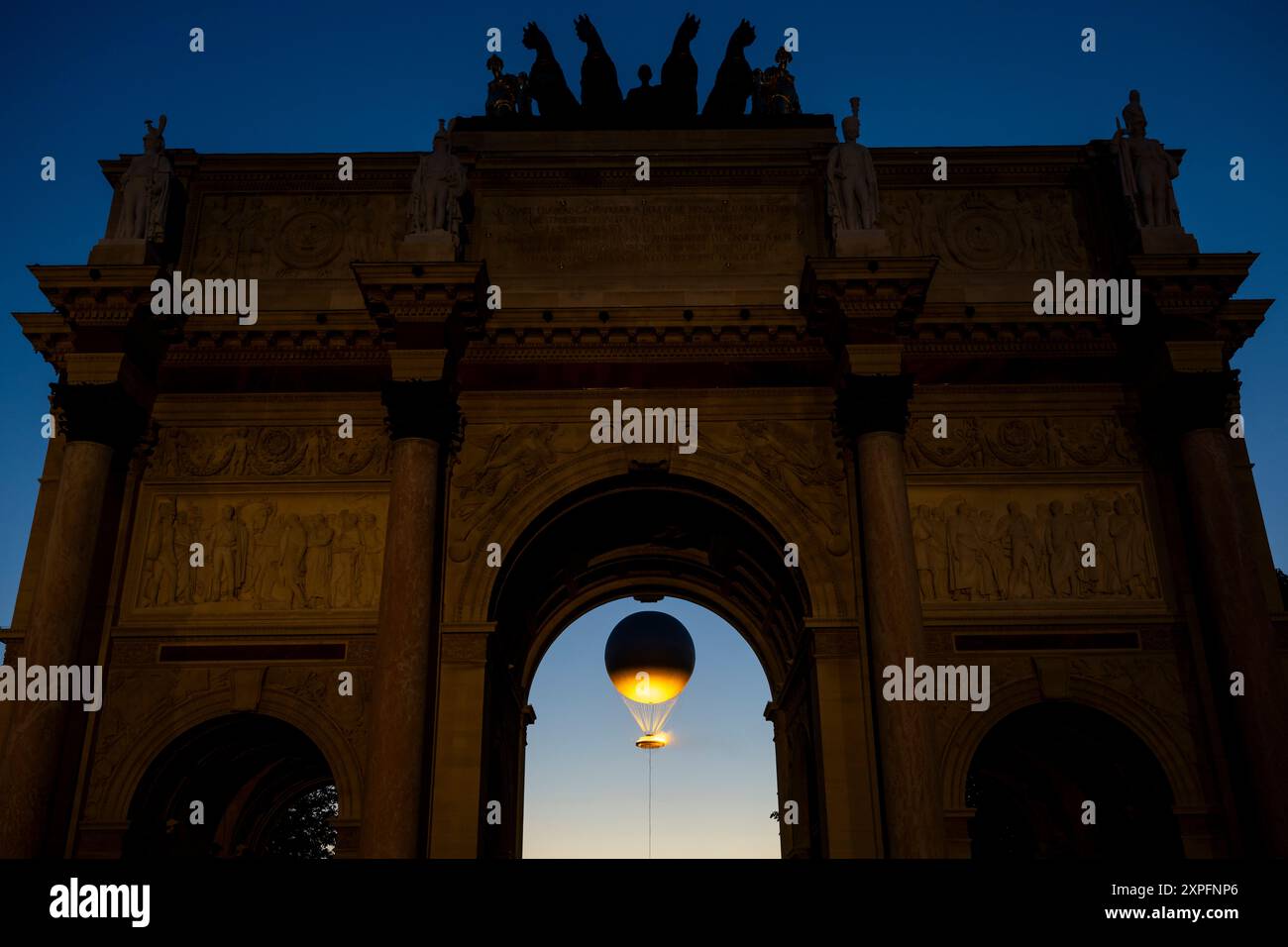 Paris, France. 05th Aug, 2024. The Olympic cauldron hangs under a hot ...