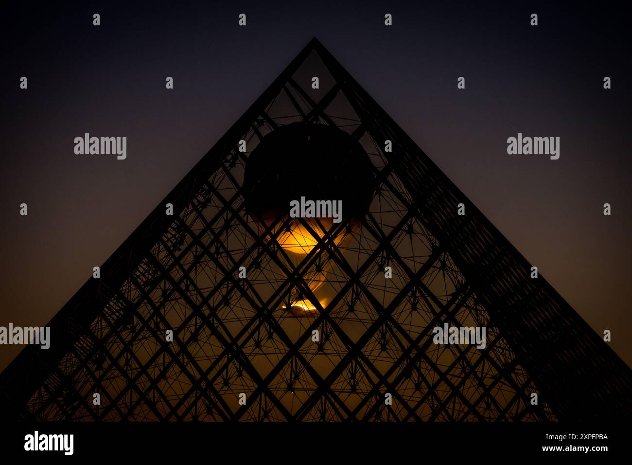 The Olympic cauldron hangs under a hot air balloon is seen during the ...