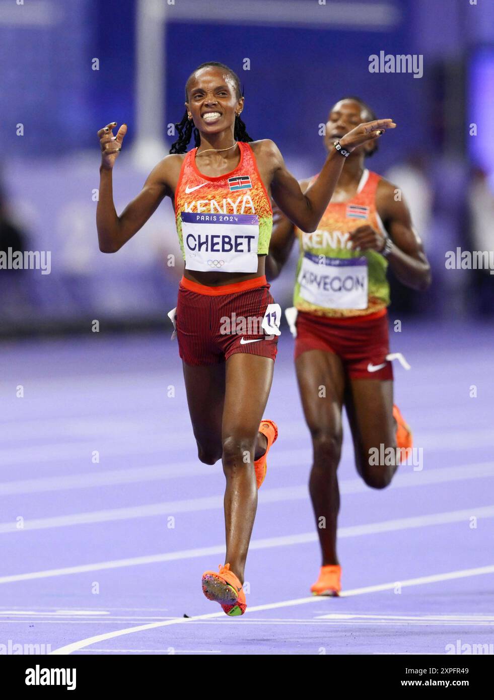 Paris, France. 5 Aug, 2024. Beatrice Chebet (L) of Kenya reacts as she ...