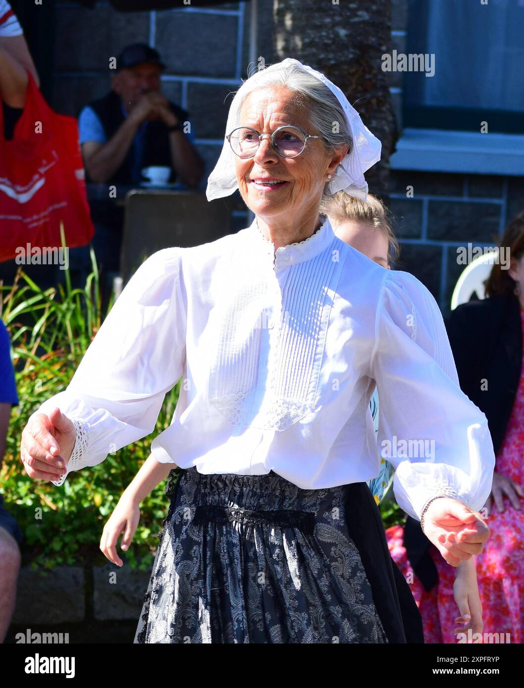Traditional Breton Fest-Noz folk dancer with members of the public in ...
