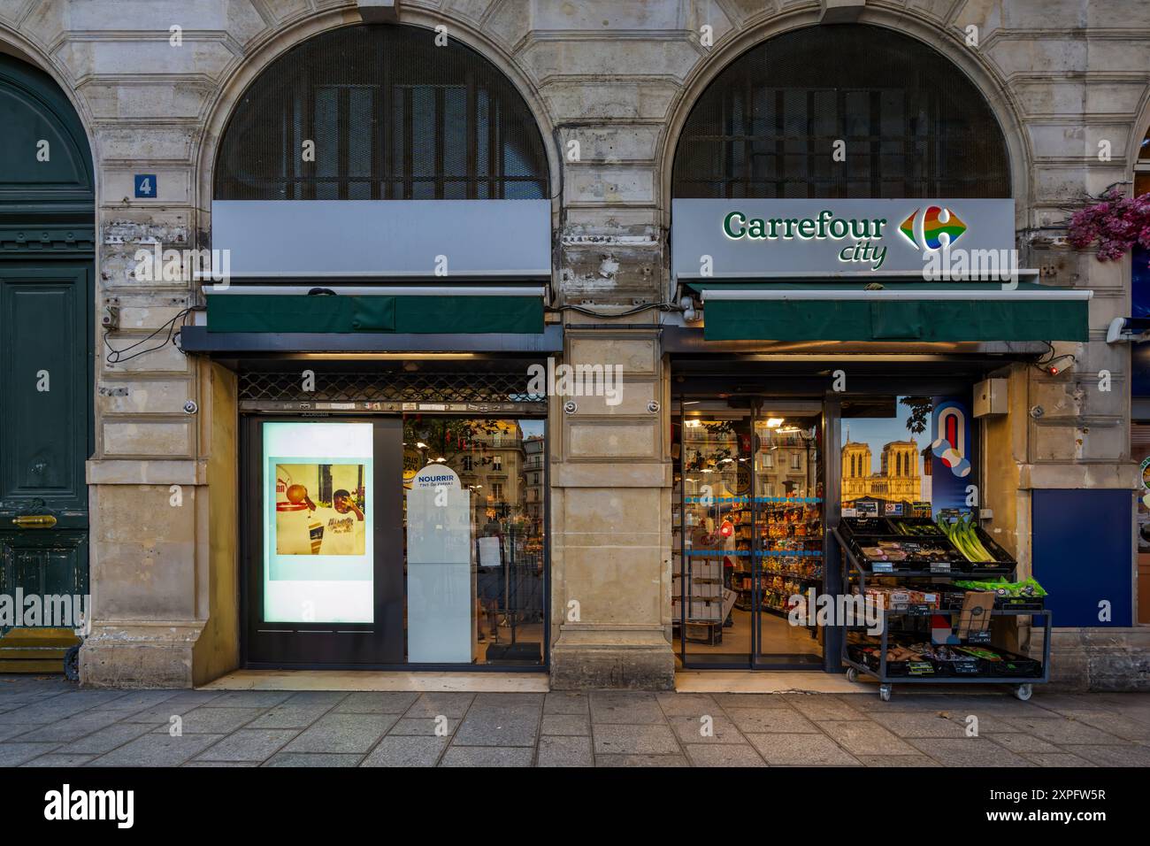 Paris, France - August 2, 2024: Historic Carrefour City wigh rainbow ...