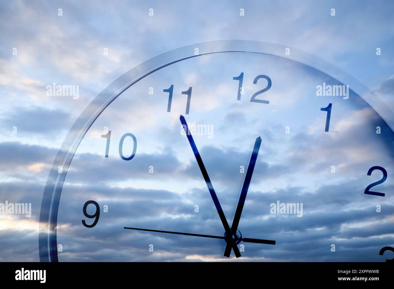 Time concept. Clock and blue sky with fluffy clouds, double exposure ...