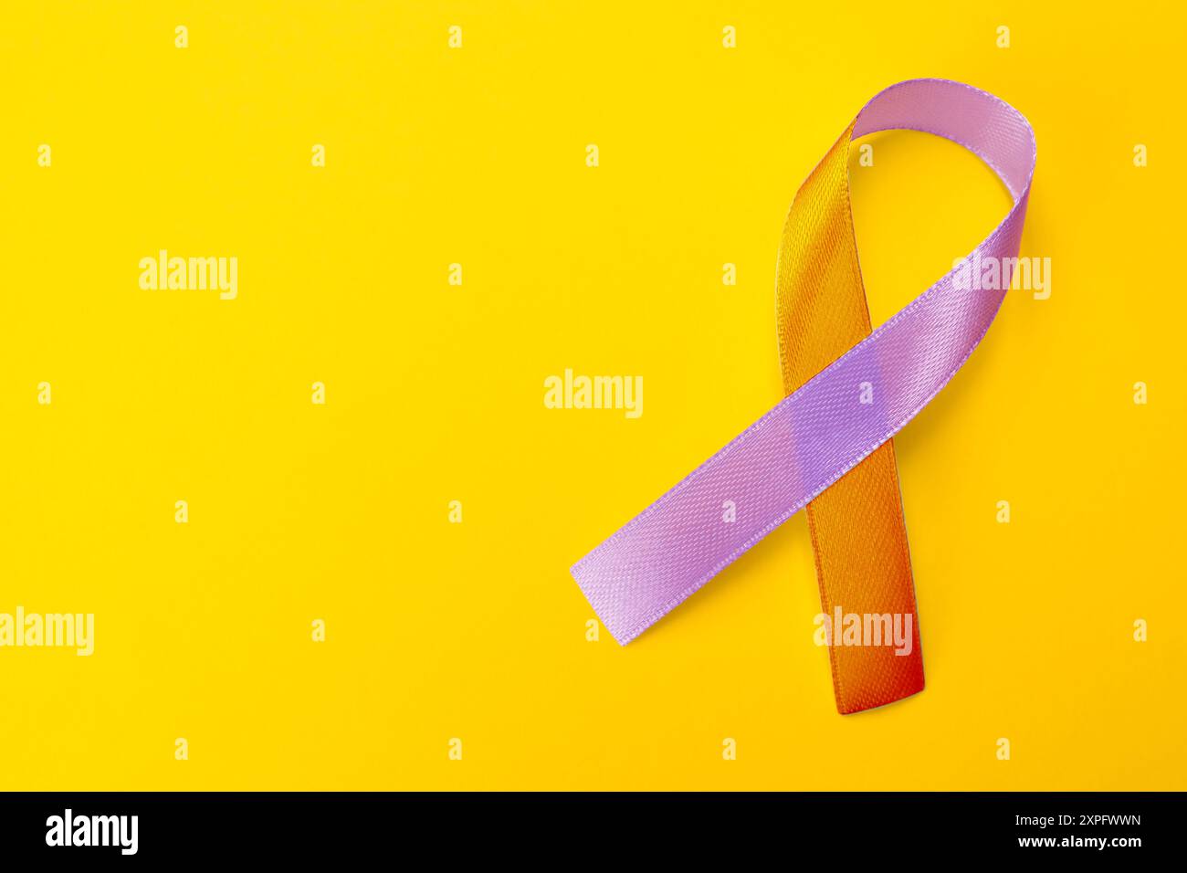 World Psoriasis Day. Orange and orchid awareness ribbon as symbol of ...