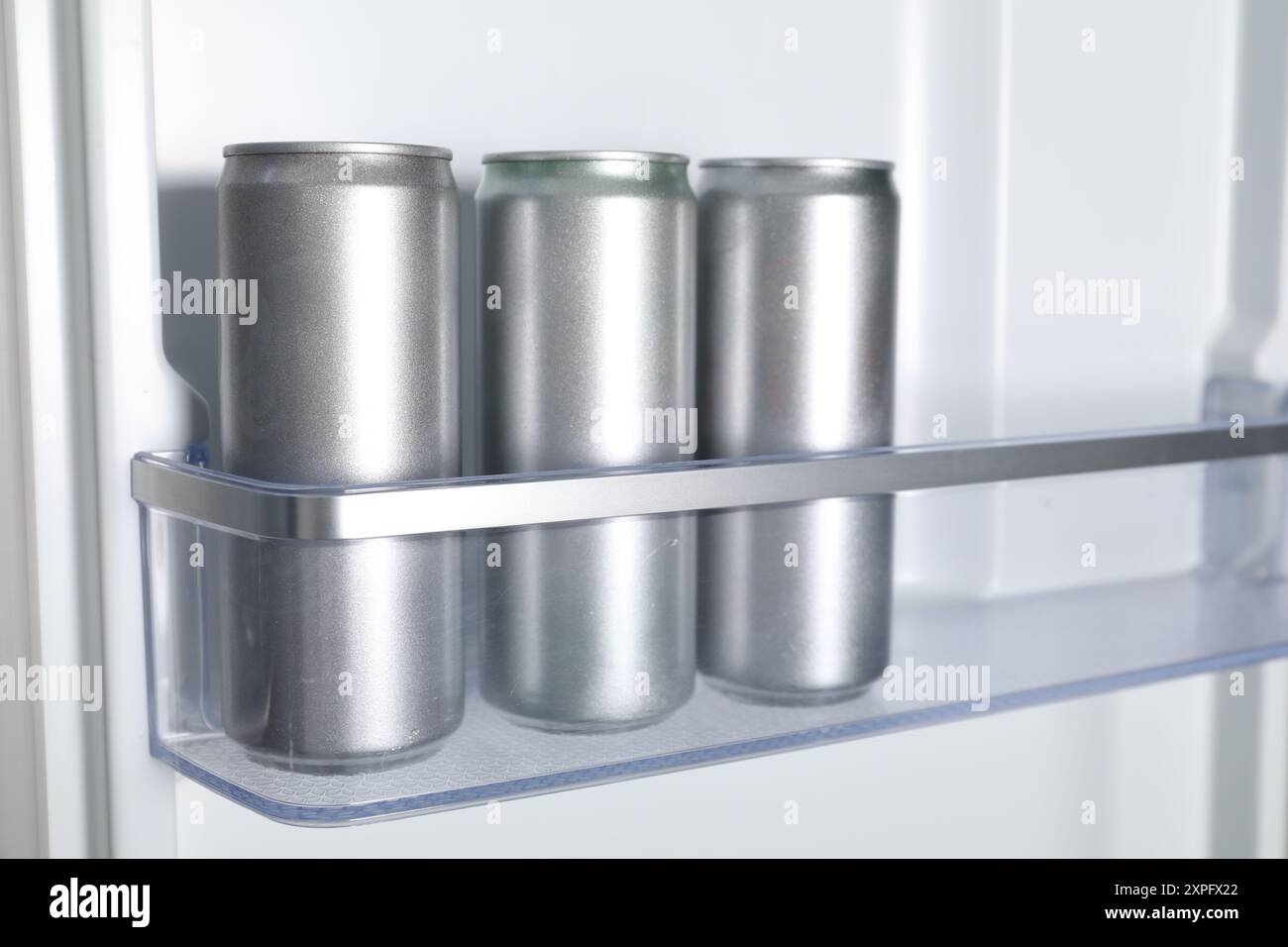 Many cans of beer in refrigerator, closeup Stock Photo - Alamy