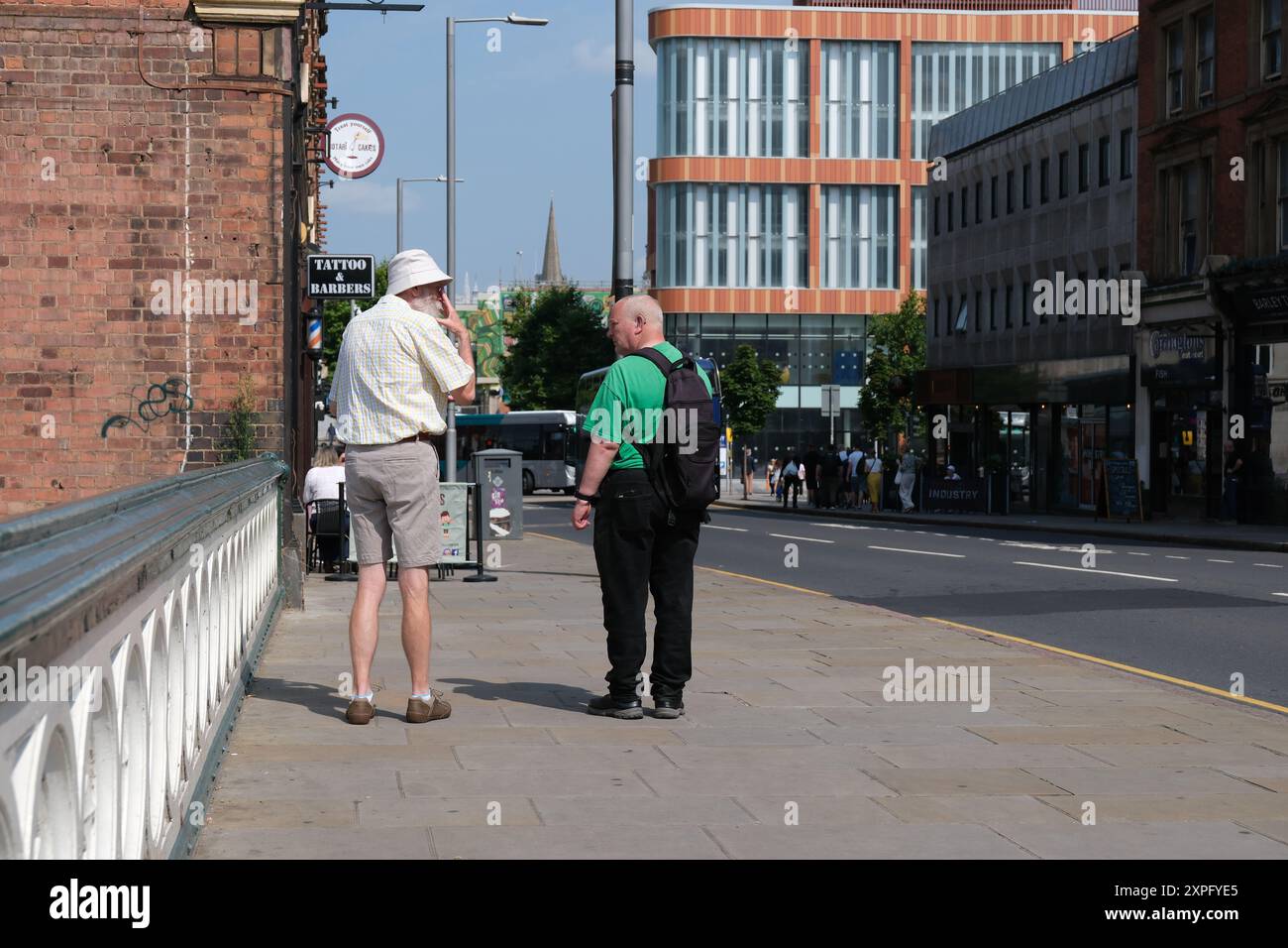 Two old men talking on a sidewalk in Nottingham City center, UK Stock ...