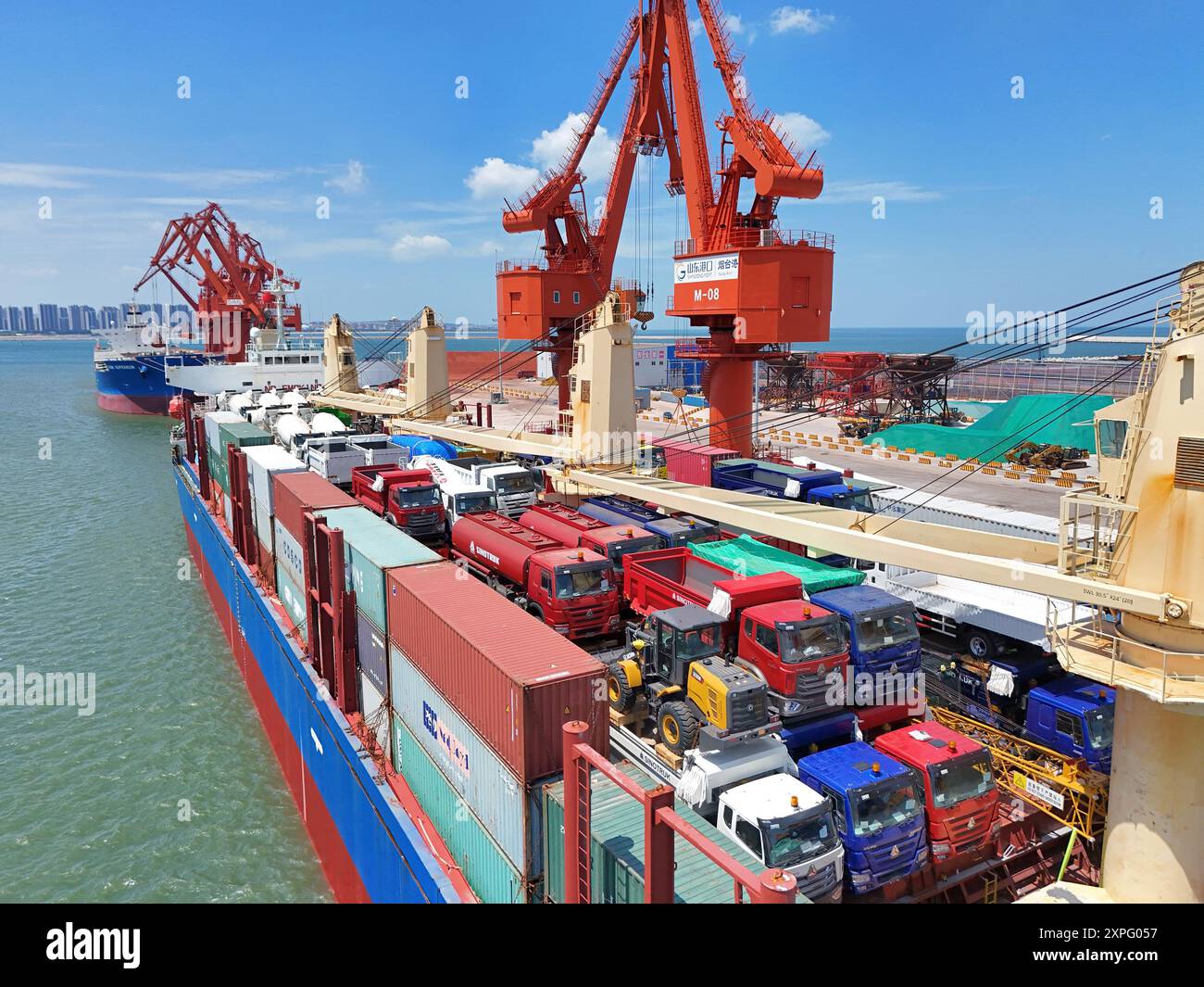 YANTAI, CHINA - JULY 31, 2024 - Cargo ships loaded with cars and ...