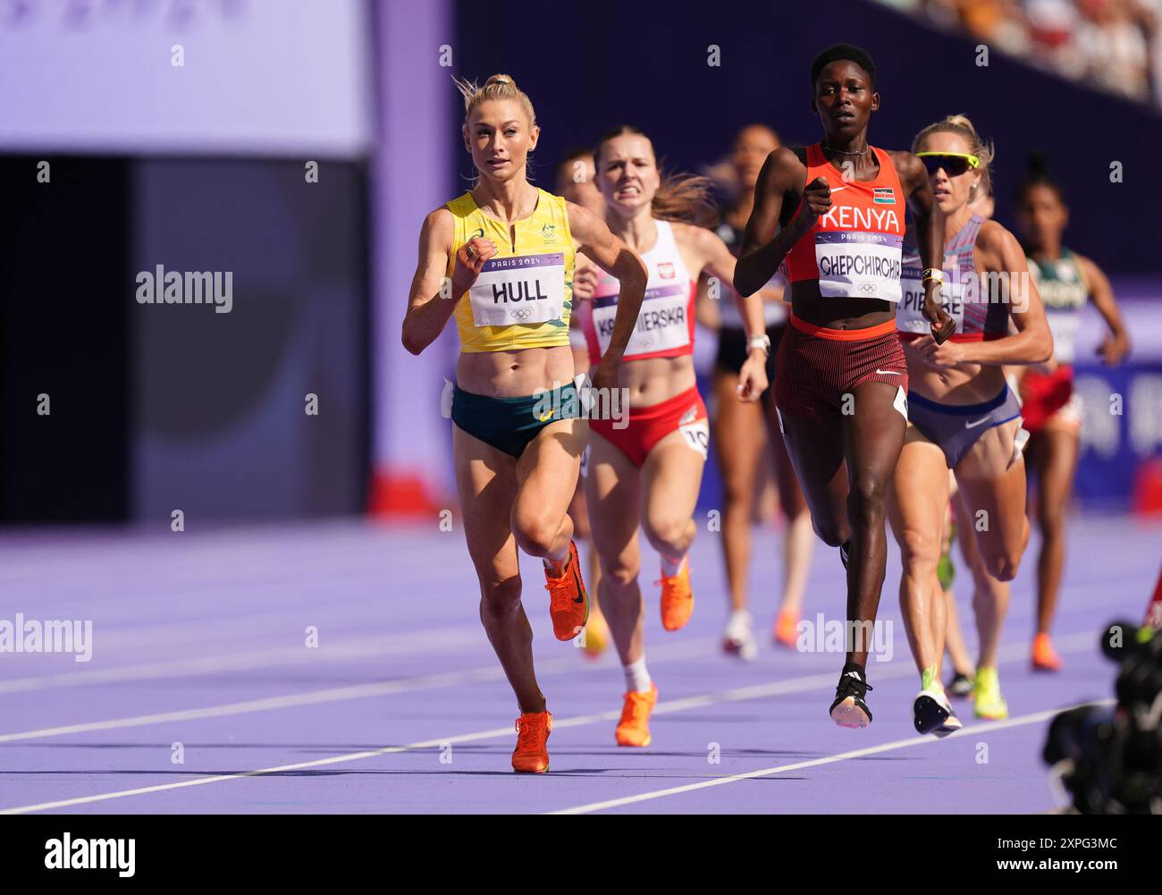 Kenya's Nelly Chepchirchir finishing first and Australia's Jessica Hull ...