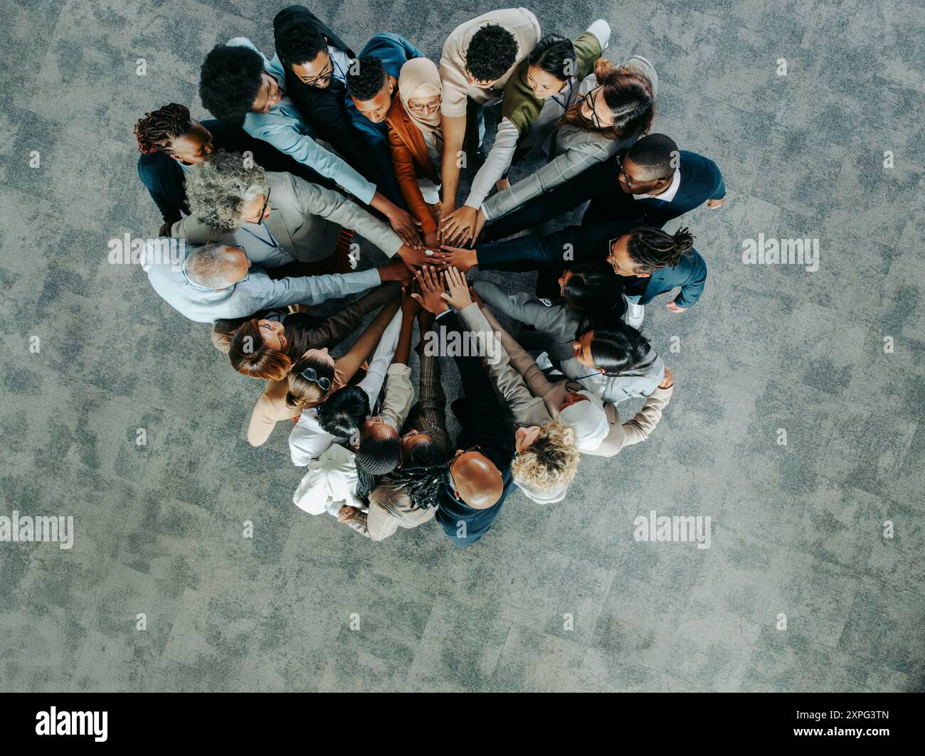 Top view of a diverse group of business colleagues showing teamwork and ...