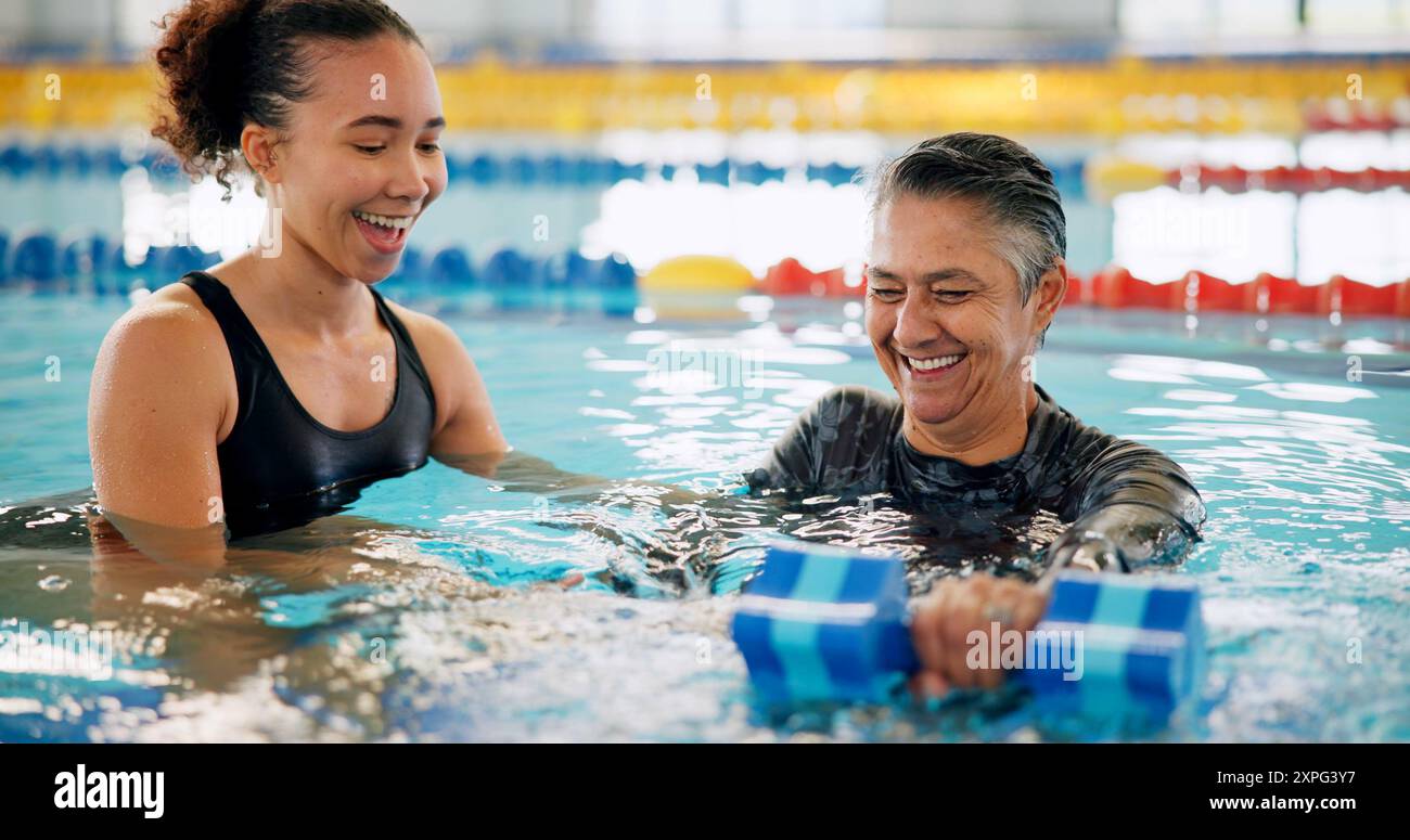 Dumbbell, training and mature woman in swimming pool for exercise ...