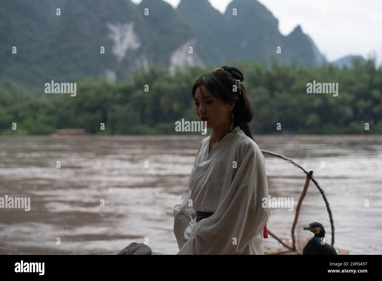 Hanfu-Clad Woman on Bamboo Raft in Xingping, China Stock Photo - Alamy