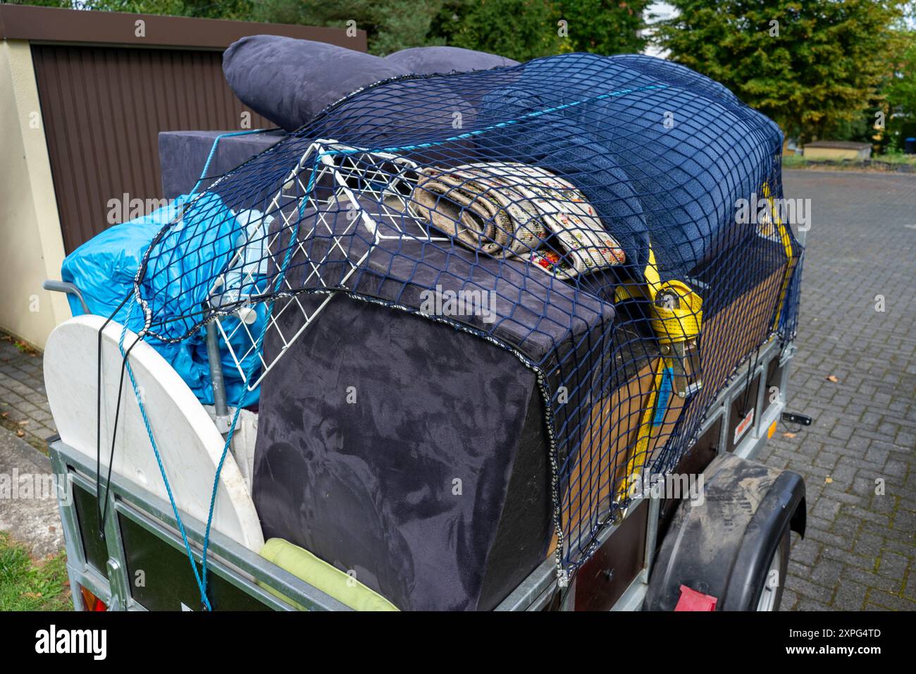Bulky waste for the recycling center on a trailer Stock Photo - Alamy