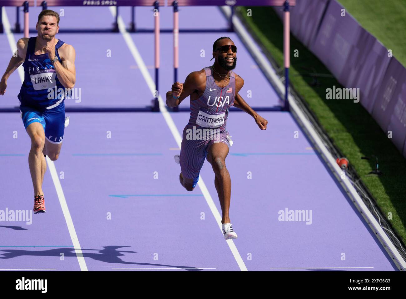 Freddie Crittenden, of the United States, crosses the finish line to ...