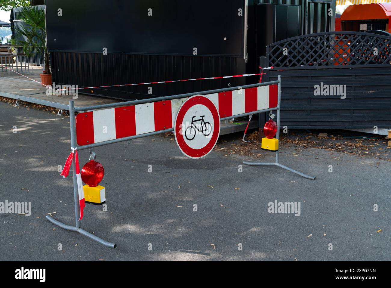 Barriers block bicycle access while roadwork takes place near a cafe in ...