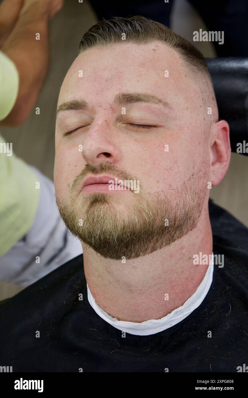 Mainz, Germany, August 27, 2023, German man shaving his beard at a ...