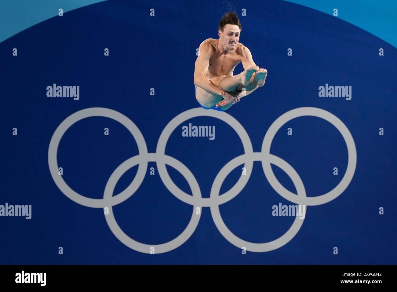 France's Gwendal Bisch competes in the men's 3m springboard diving ...