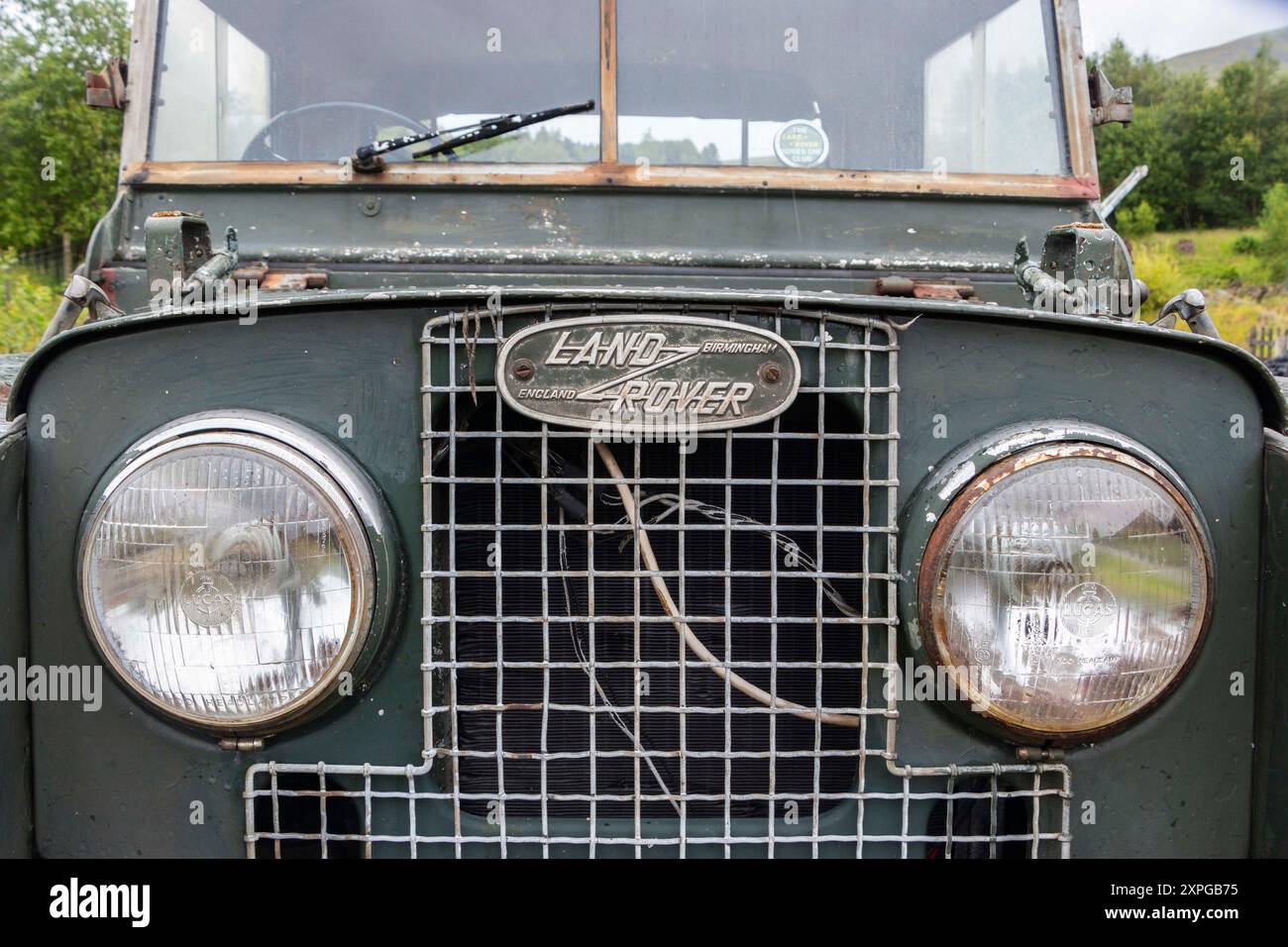 front of vintage green classic land rover defender at Threlkeld Quarry ...