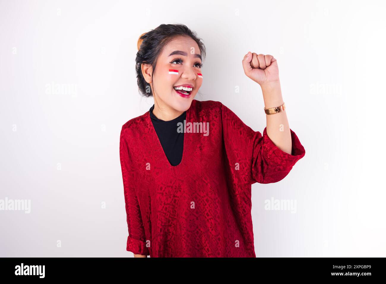an asian woman in a red dress, poses expression for celebrating ...