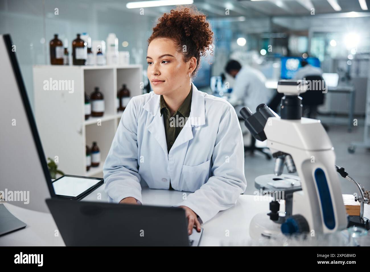 Computer, DNA and science with woman in laboratory for development ...