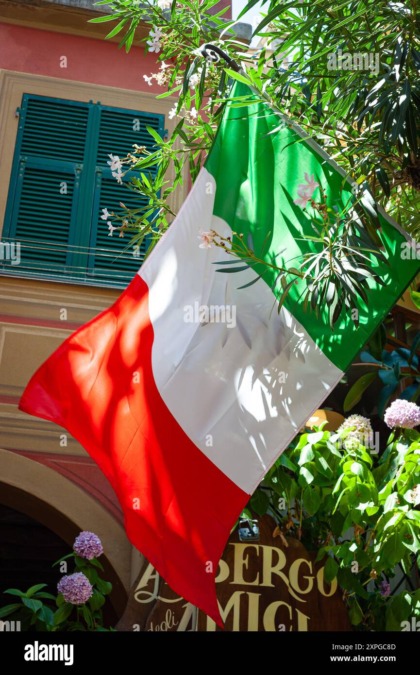 Nice view of a large italian flag in the streets of the historic town ...