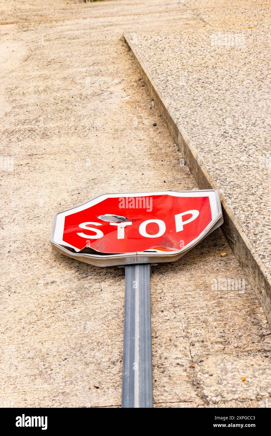 stop road sign laying on the ground Stock Photo - Alamy