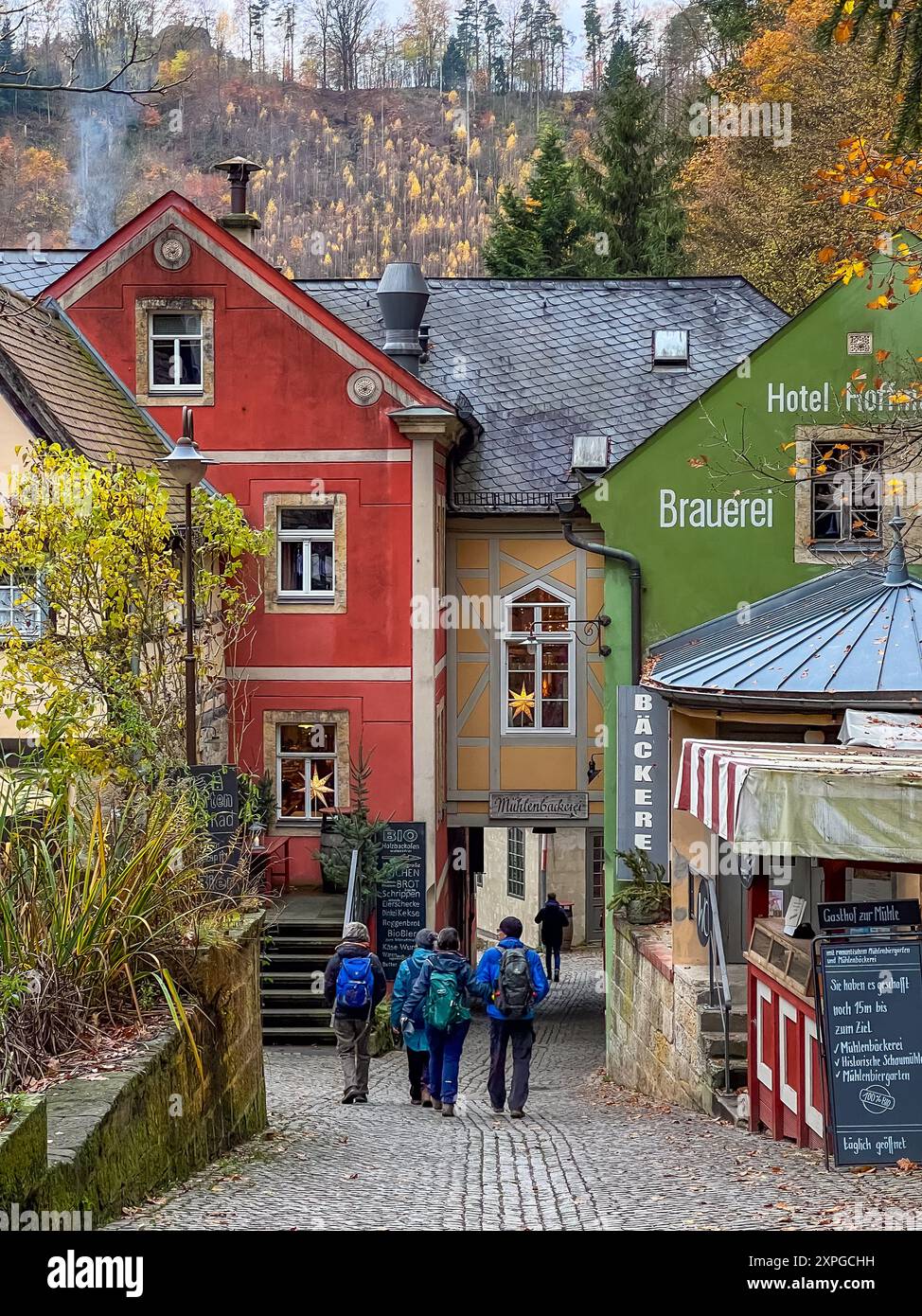 Schmilka, Germany - November 18, 2023: Tourists in outdoor clothes with ...