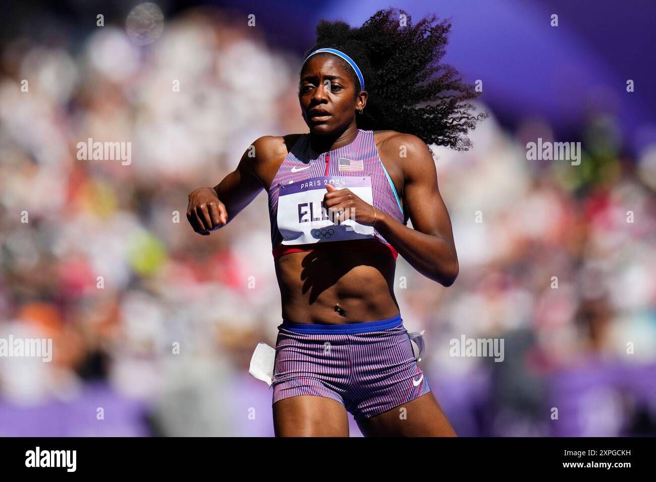 Kendall Ellis of the United States, reacts as she crosses the finish ...