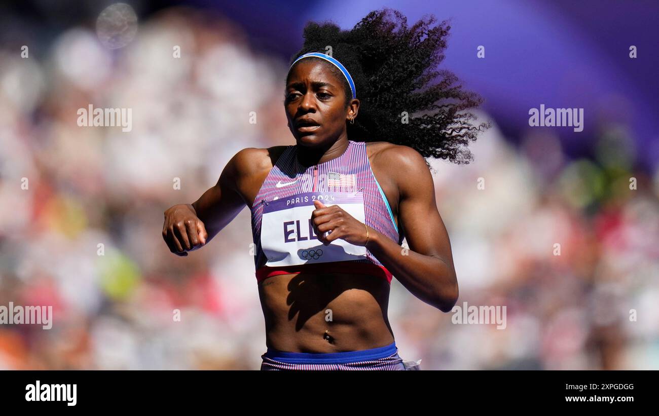 Kendall Ellis of the United States, reacts as she crosses the finish ...
