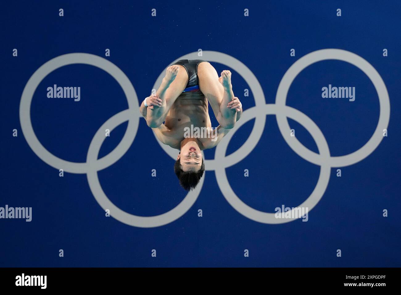South Korea's Woo Ha-ram competes in the men's 3m springboard diving ...