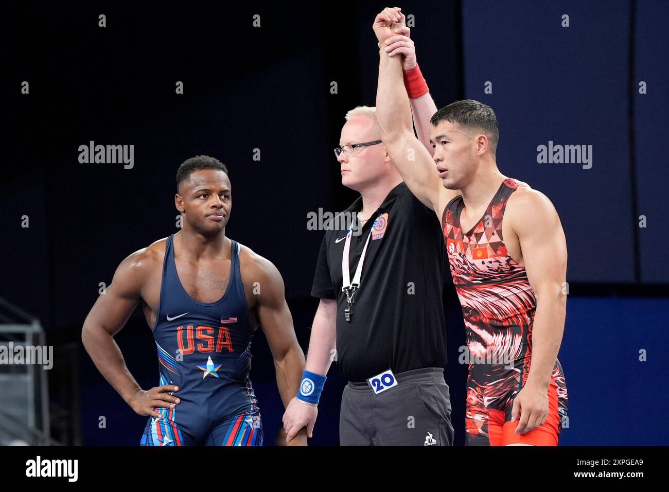 Kyrgyzstan's Akzhol Makhmudov, right, celebrates after defeating United ...