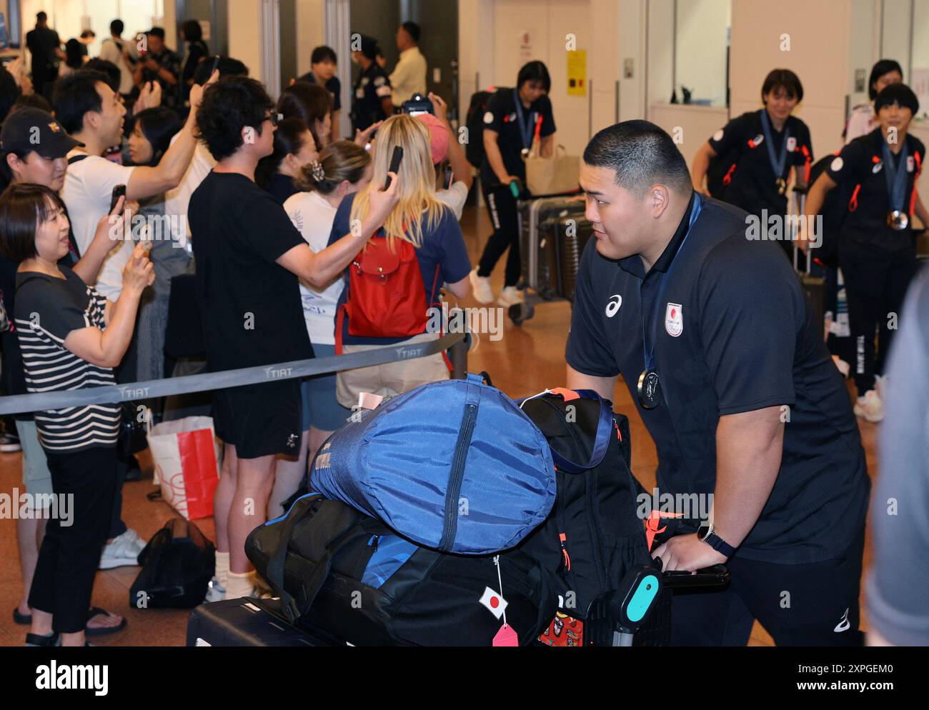 Tatsuru Saito of Japan arrives at Haneda Airport in Tokyo on August 6 ...