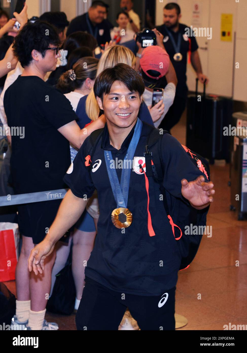 Hifumi Abe of Japan arrives at Haneda Airport in Tokyo on August 6 ...