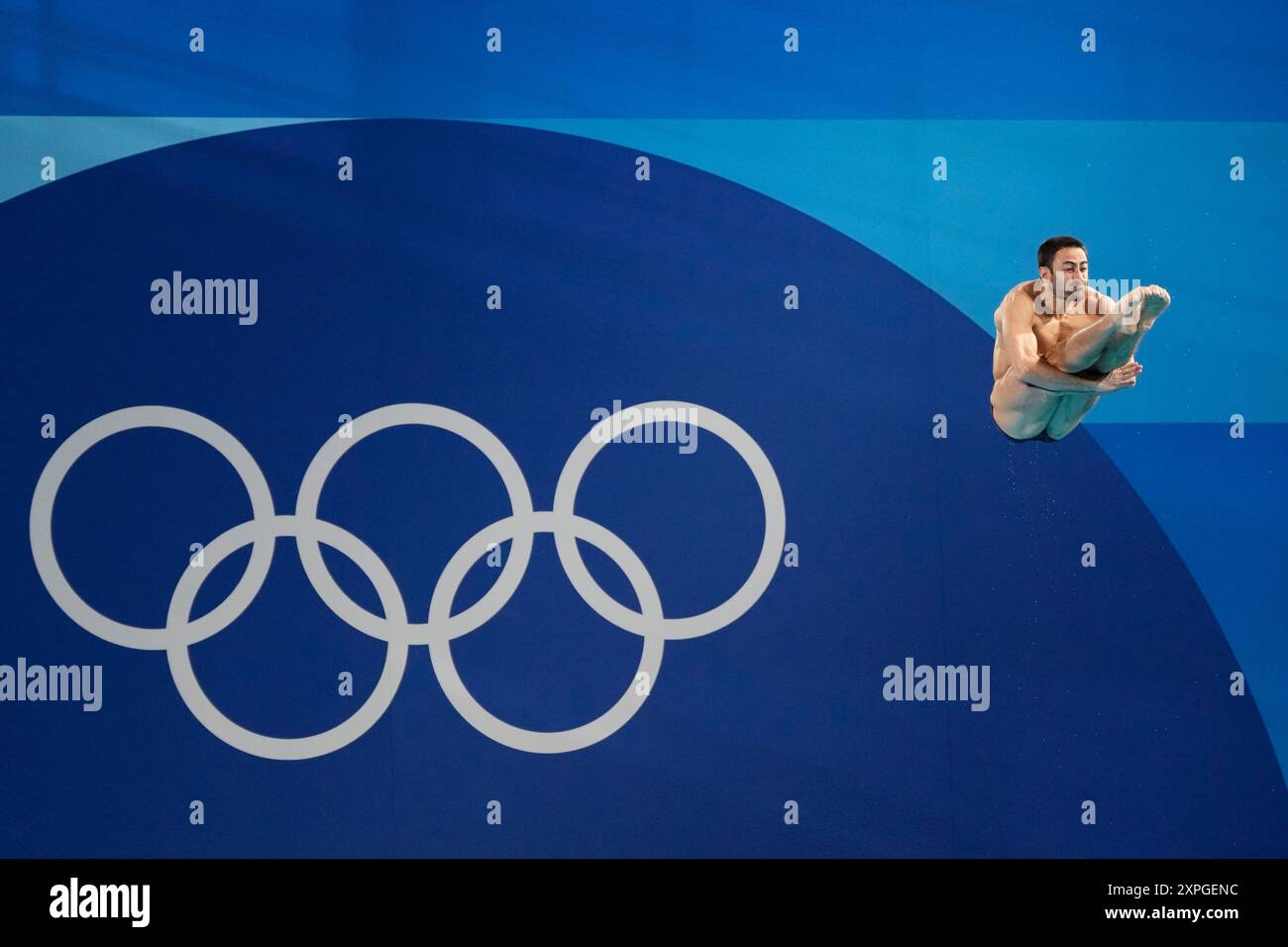 Italy's Giovanni Tocci competes in the men's 3m springboard diving ...