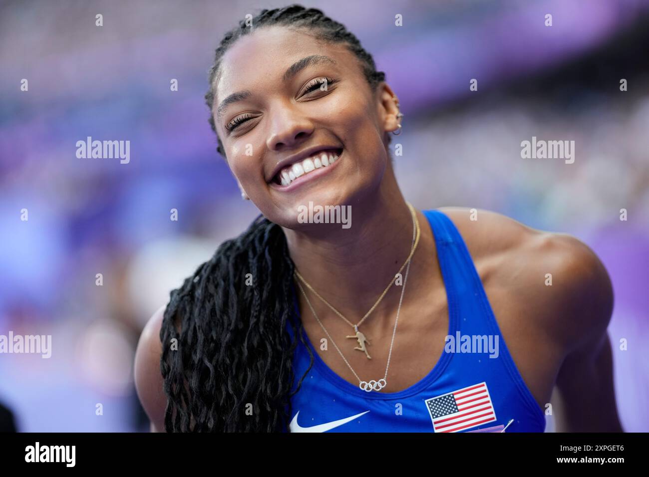 Tara Davis-Woodhall, of the United States, smiles while competing ...