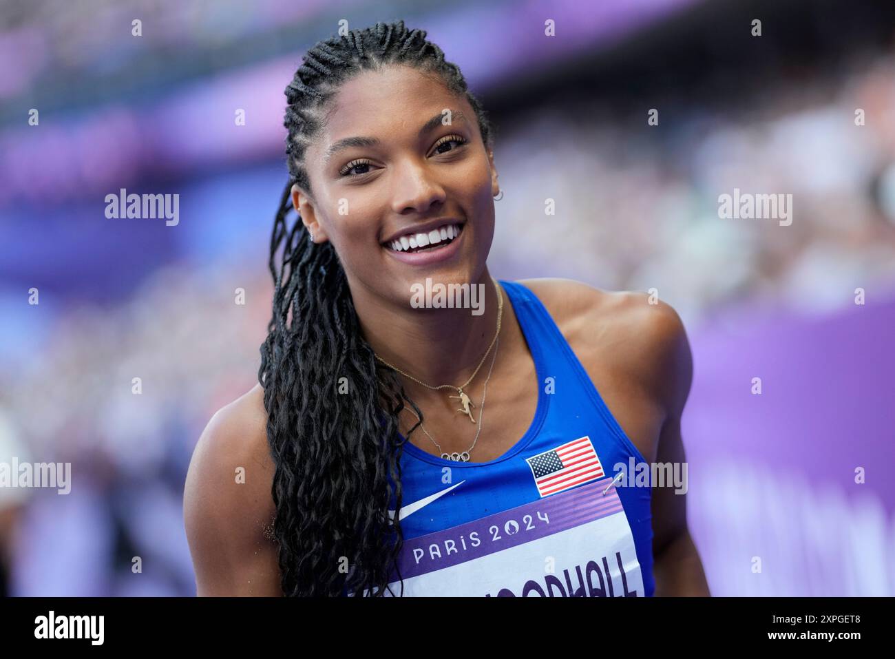 Tara Davis-Woodhall, of the United States, smiles while competing ...