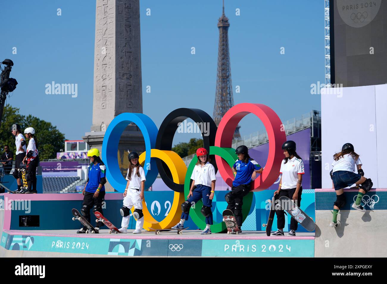 Athletes warm up before the women's skateboarding park preliminaries at ...