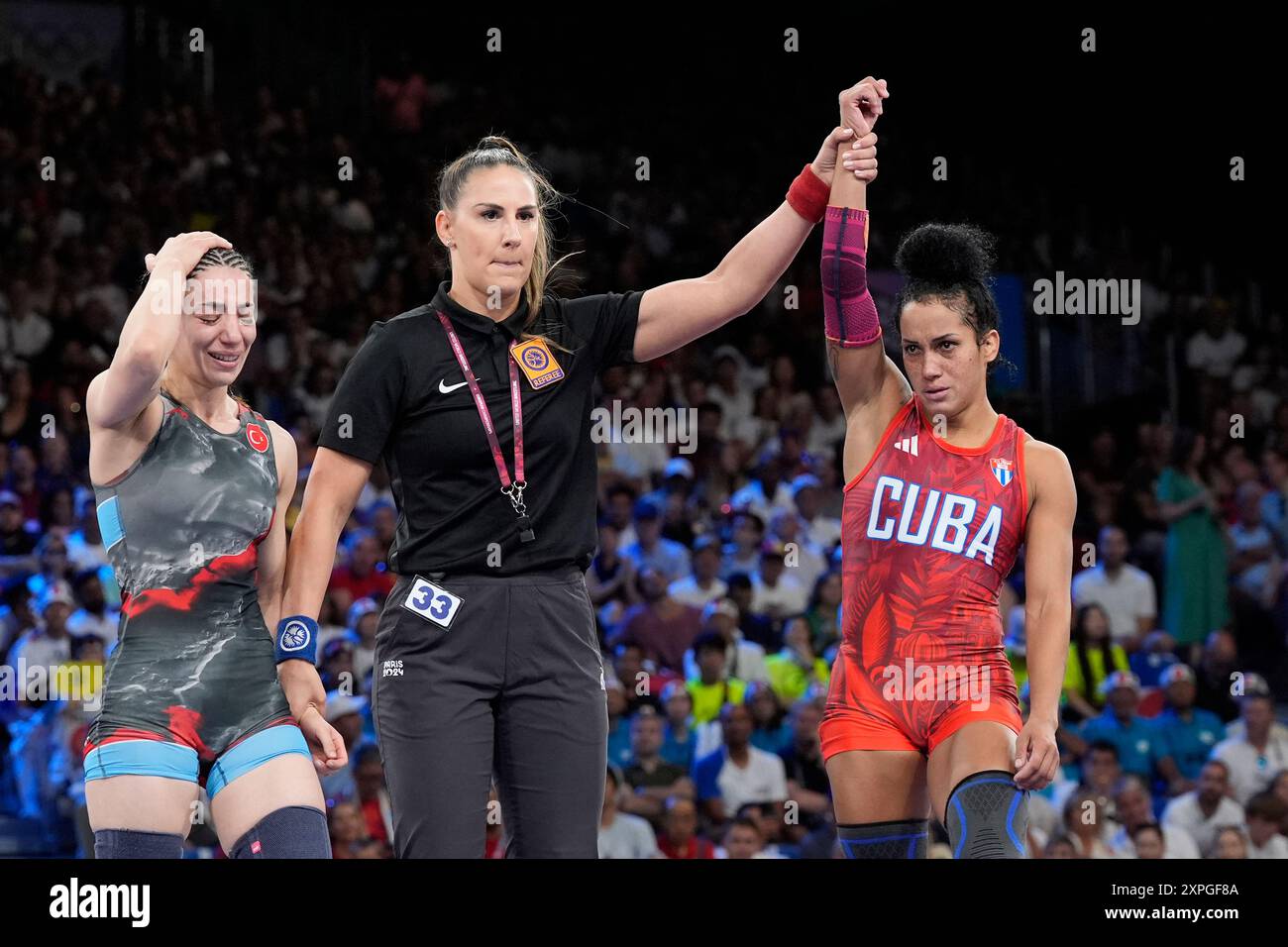 Cuba's Yusneylis Guzman, right, celebrates after defeating Turkey's ...