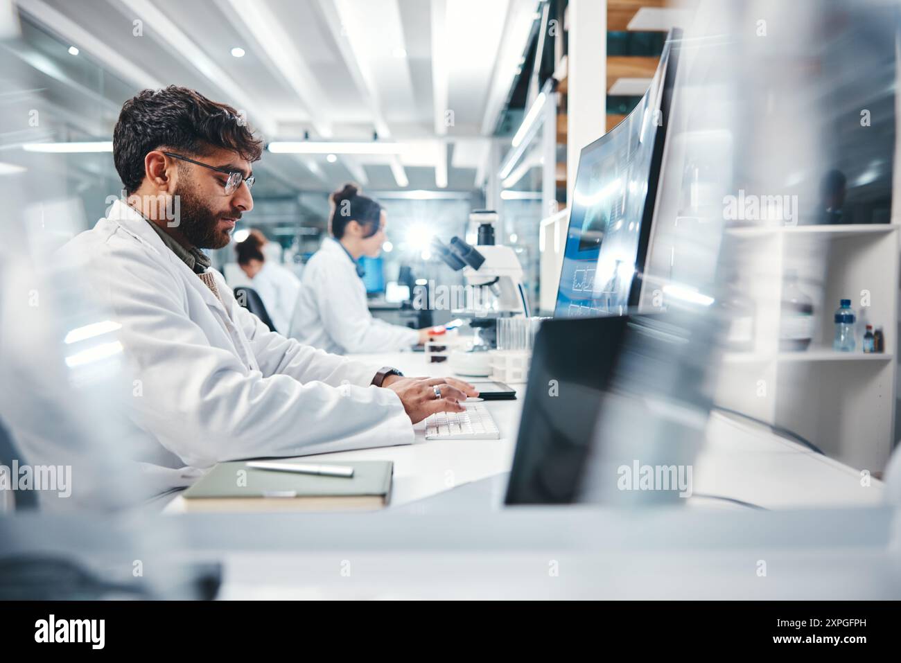 Scientist man typing on computer hi-res stock photography and images ...